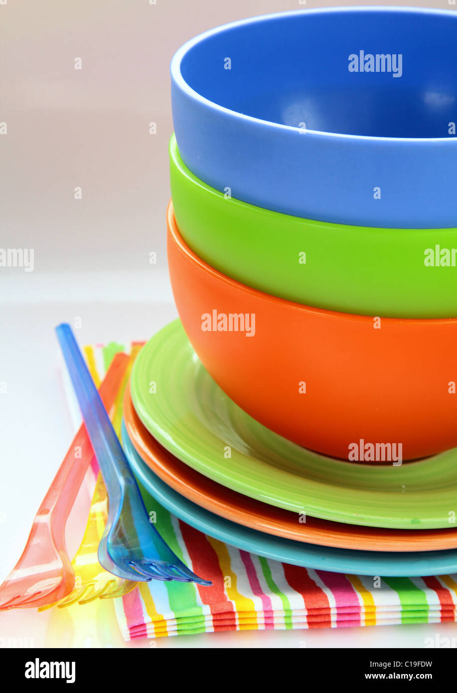 colorful plastic tableware and napkins for picnics Stock Photo - Alamy