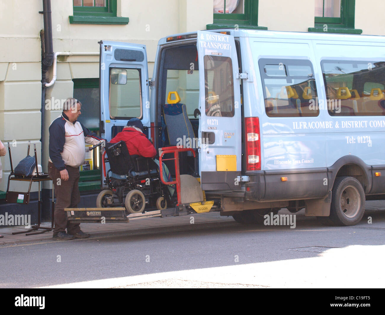 Old person in a wheelchair on a vehicle lift, Devon, UK Stock Photo - Alamy