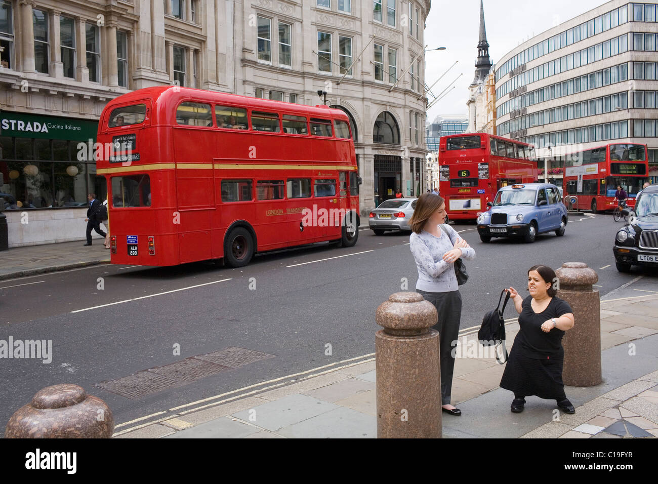 A traditional red London routemaster bus and a dwarf Stock Photo - Alamy