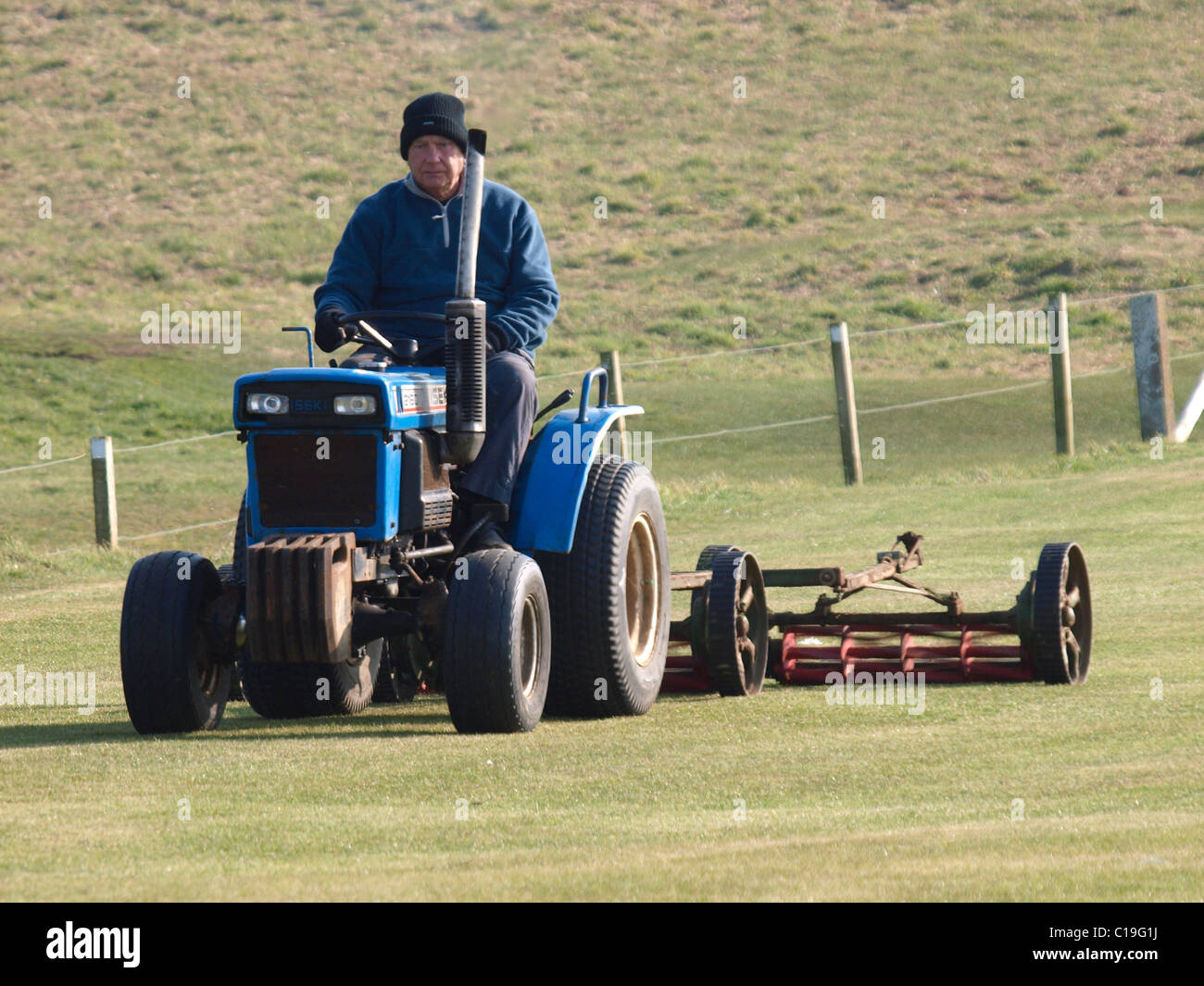 Old man on a ride on mower, UK Stock Photo - Alamy