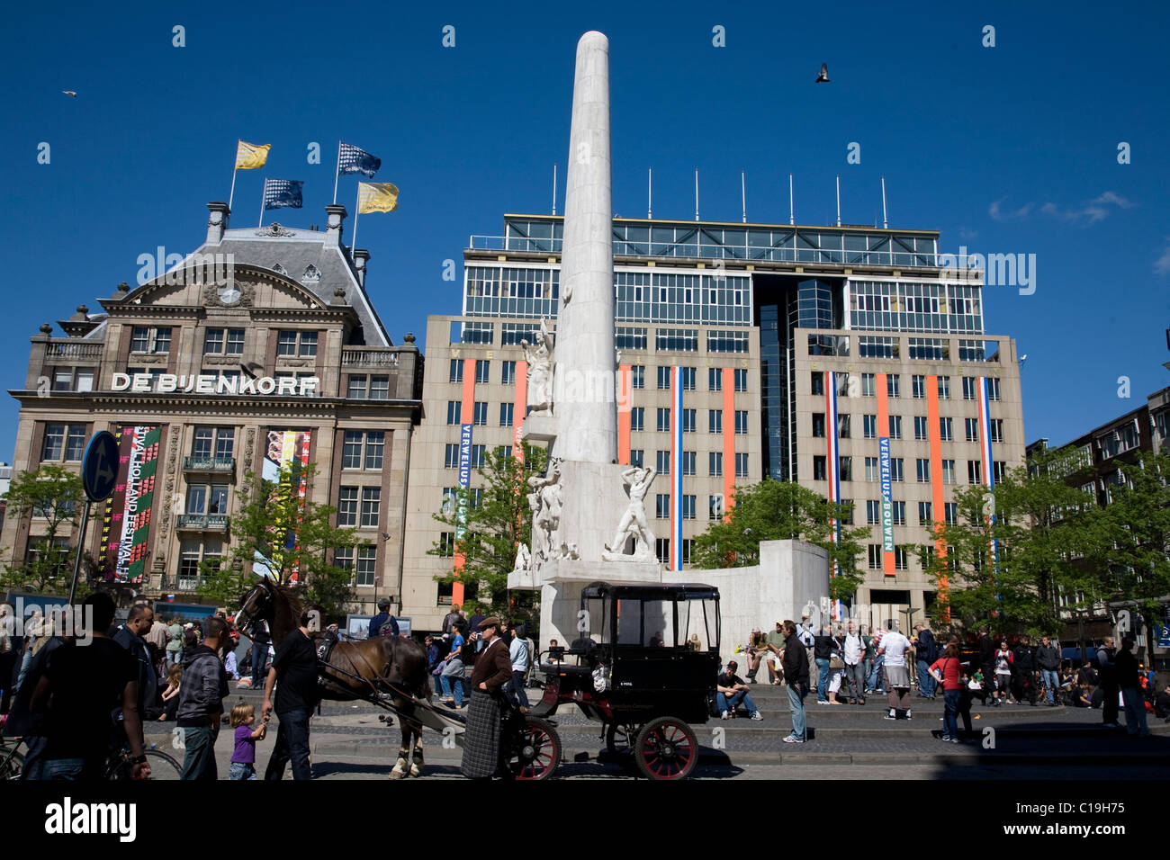 Horse drawn carriage in Dam Square in front of the National Monument ...
