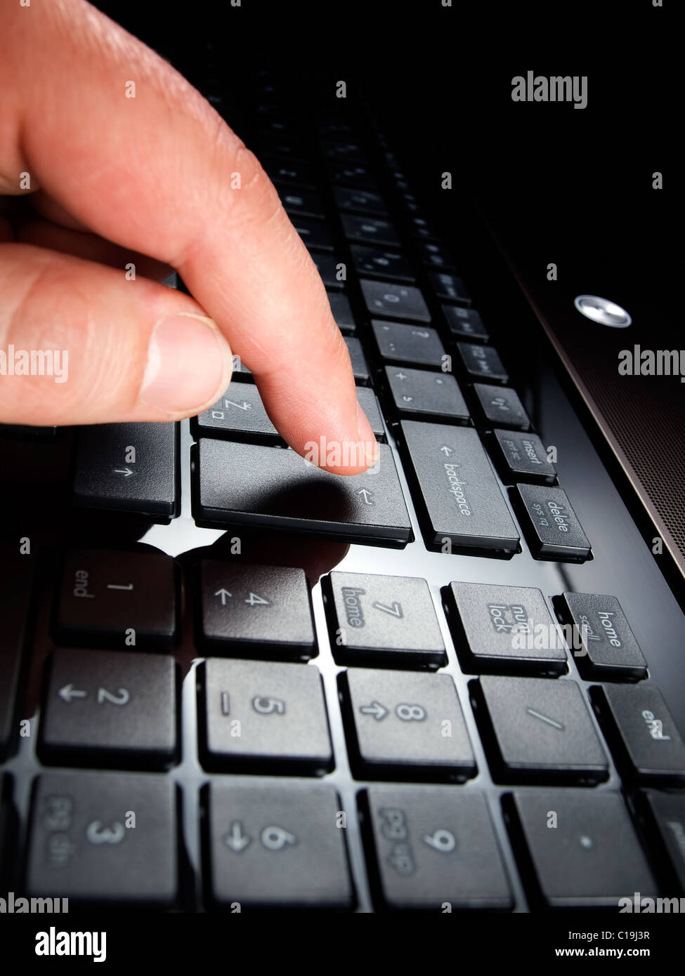 Human finger is pressing ENTER button on computer keyboard Stock Photo ...