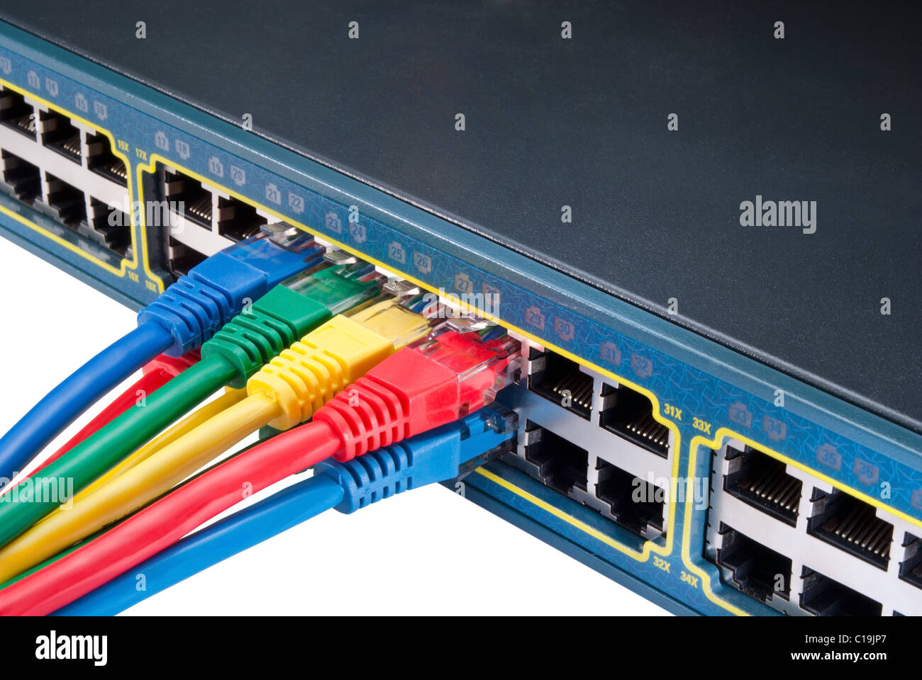 Bunch of Colored ethernet network cables connected to a switch isolated ...