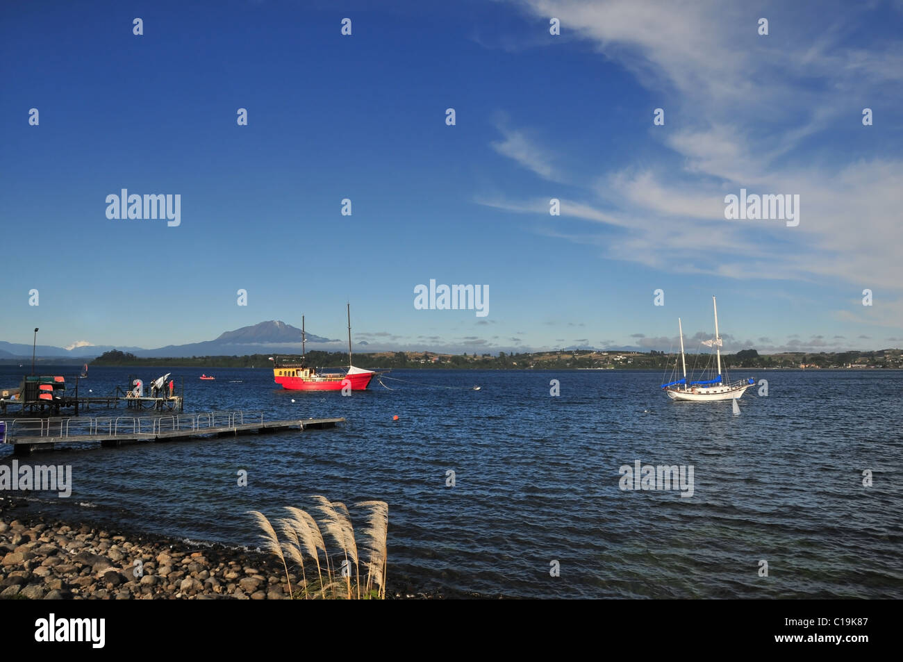 Blue view of Lake Llanquihue, towards Volcan Calbuco, shoreline Pampas ...
