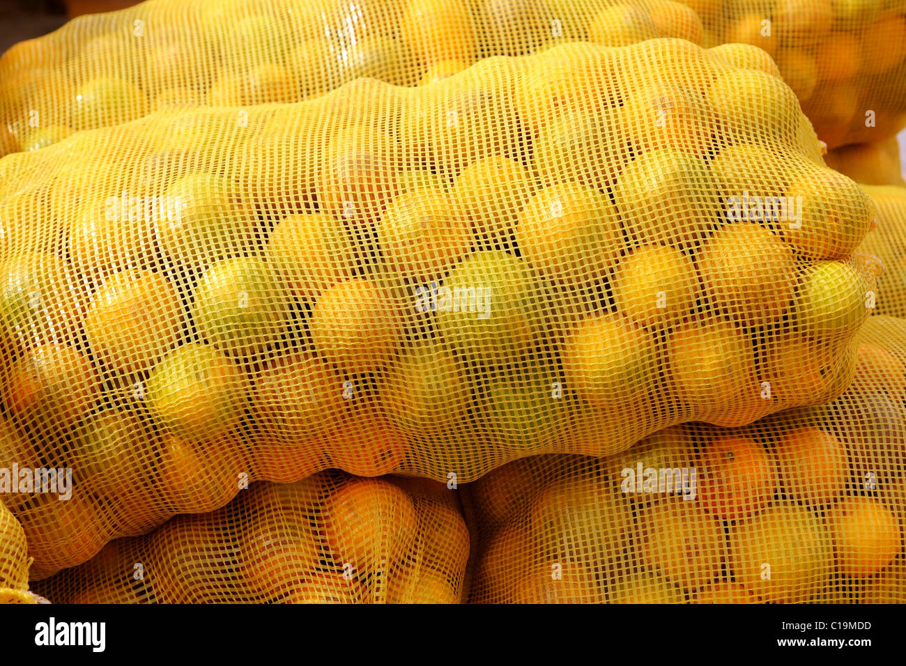 many orange sack citrus stacked fruits Stock Photo - Alamy