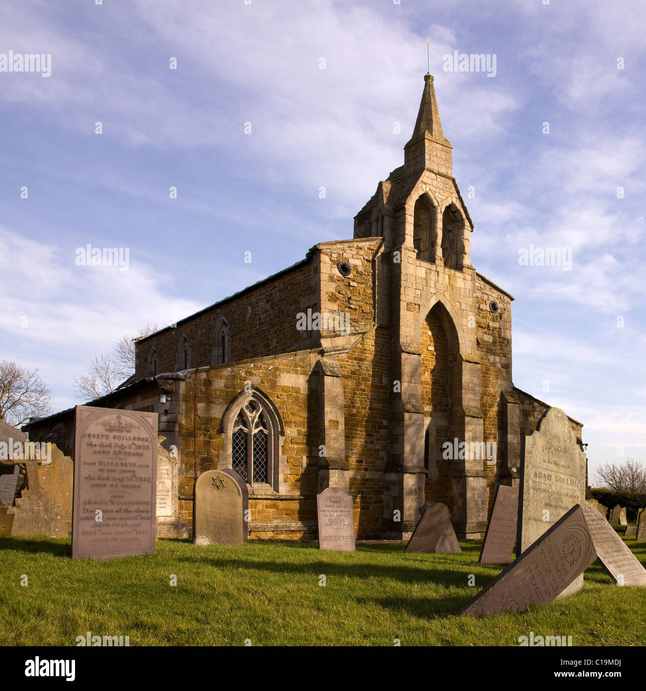Headstones around the bell tower of St. James Church, Burton Lazars ...