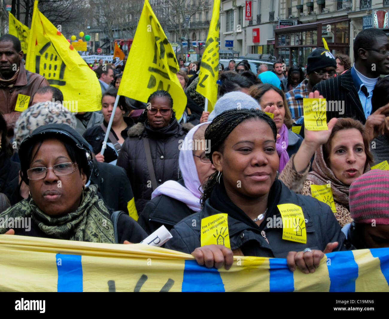 Front african immigrants immigration marching holding protest banners ...