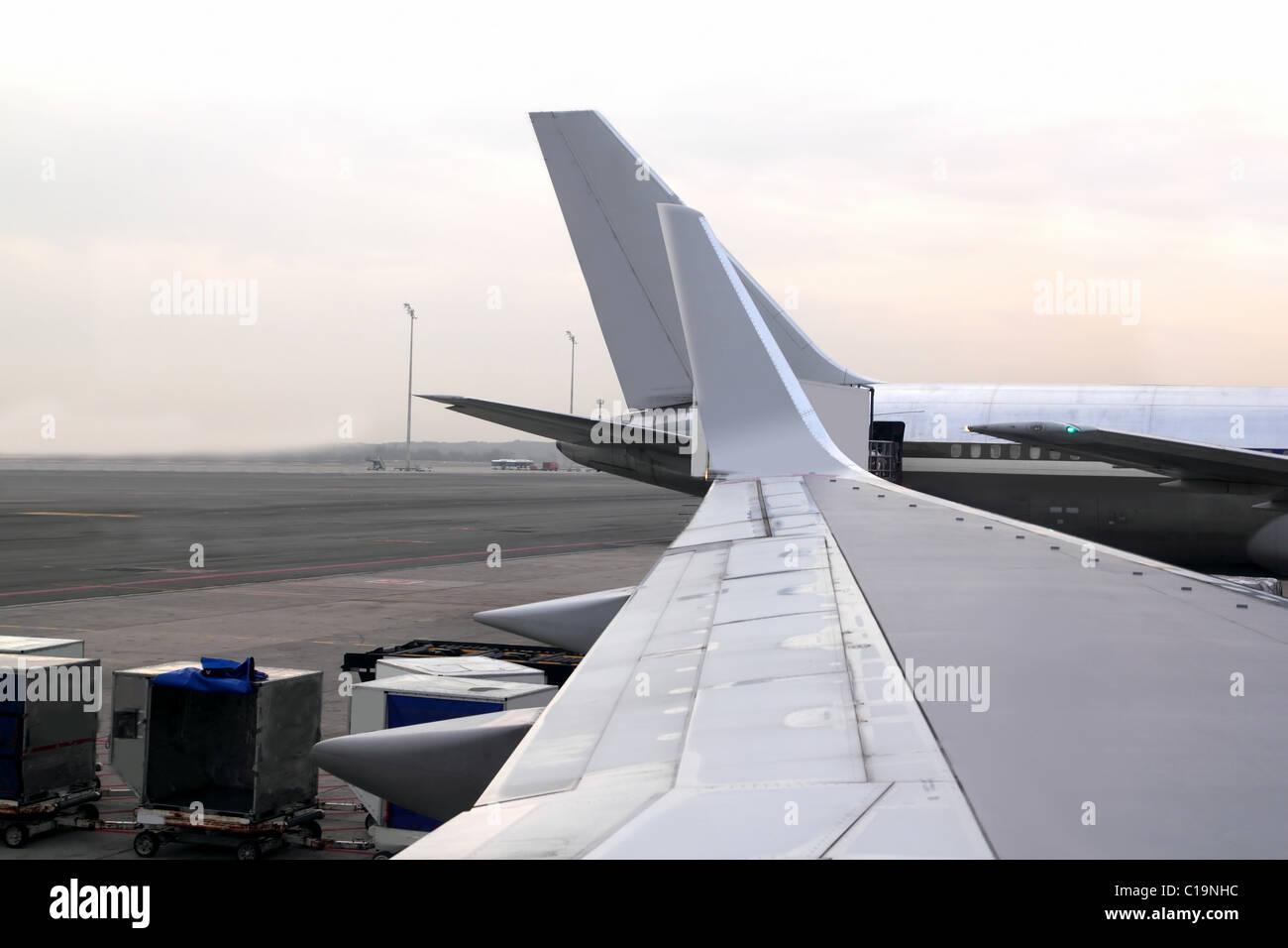 aircraft airplane landed wing perspective in airport Stock Photo - Alamy