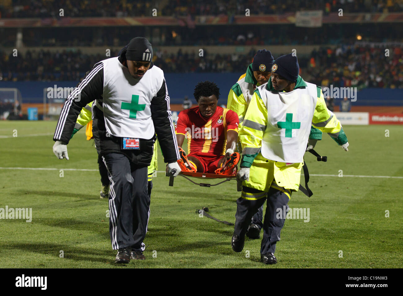 Samuel Inkoom of Ghana is stretchered off the pitch after being shaken ...
