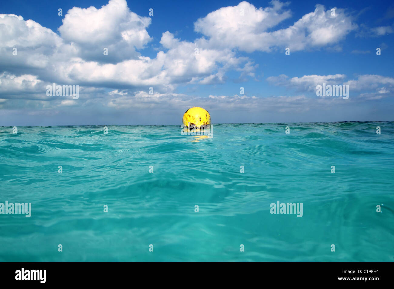 Buoy yellow floating in tropical Caribbean sea blue sky Stock Photo - Alamy