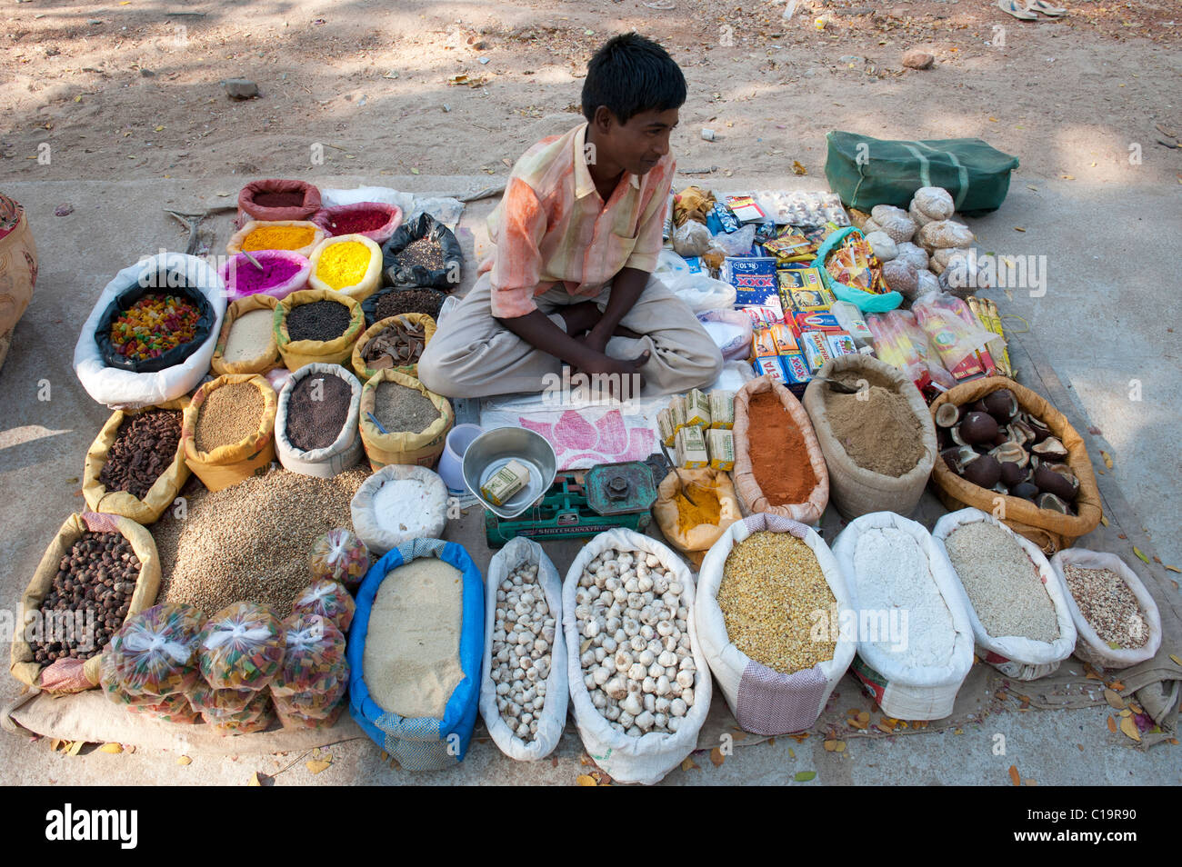 Indian street market with sacks of Indian spices and dried produce and ...