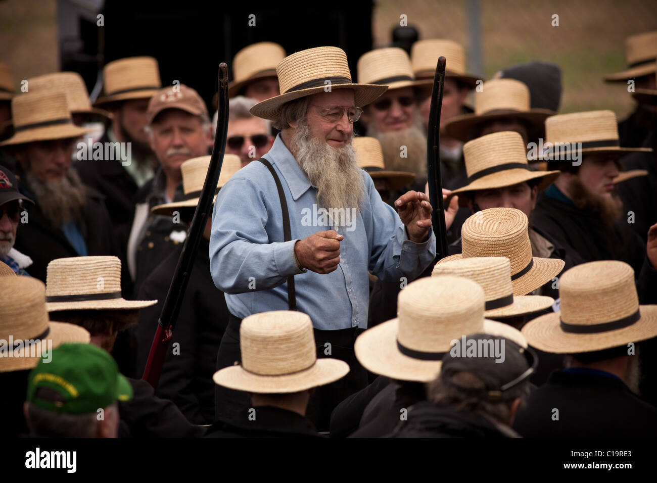 Amish men bid on horse buggies during the Annual Mud Sale to support ...