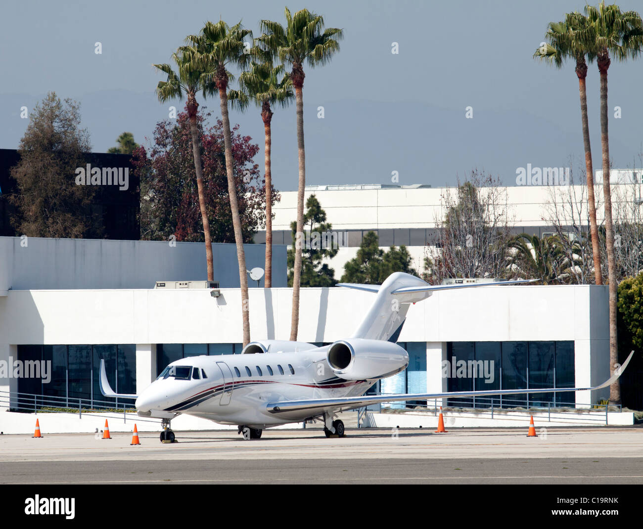 Private jet sitting on the tarmac Stock Photo - Alamy