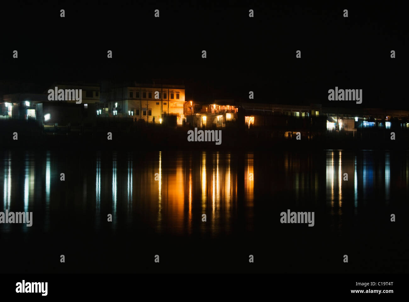 Reflection of buildings in water, Ganges River, Rishikesh, Uttarakhand ...