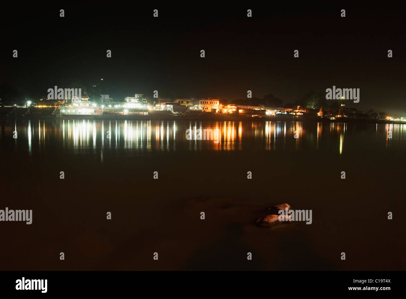 Reflection of buildings in water, Ganges River, Rishikesh, Uttarakhand ...