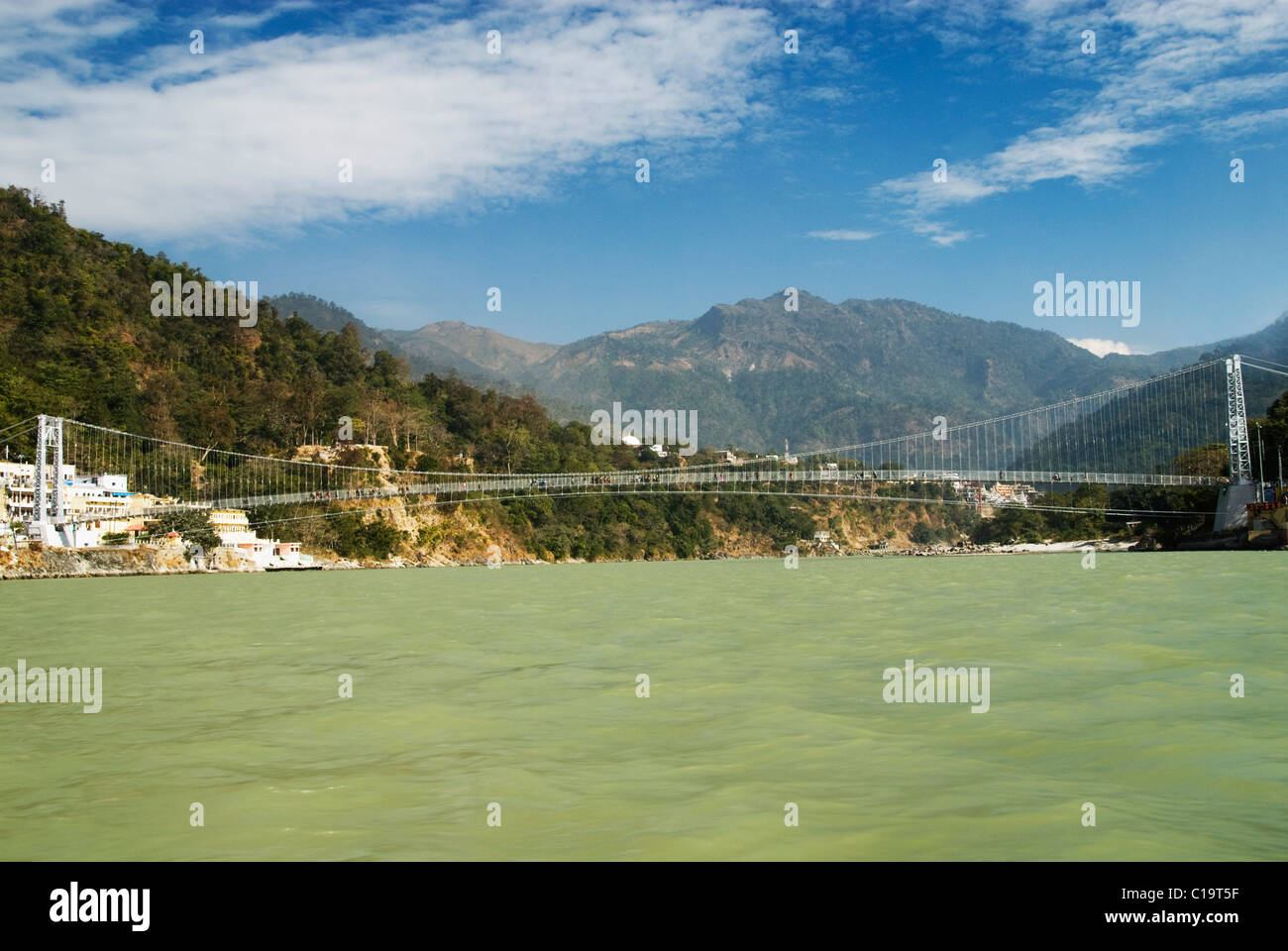 Suspension bridge across a river, Ram Jhula, Ganges River, Rishikesh ...