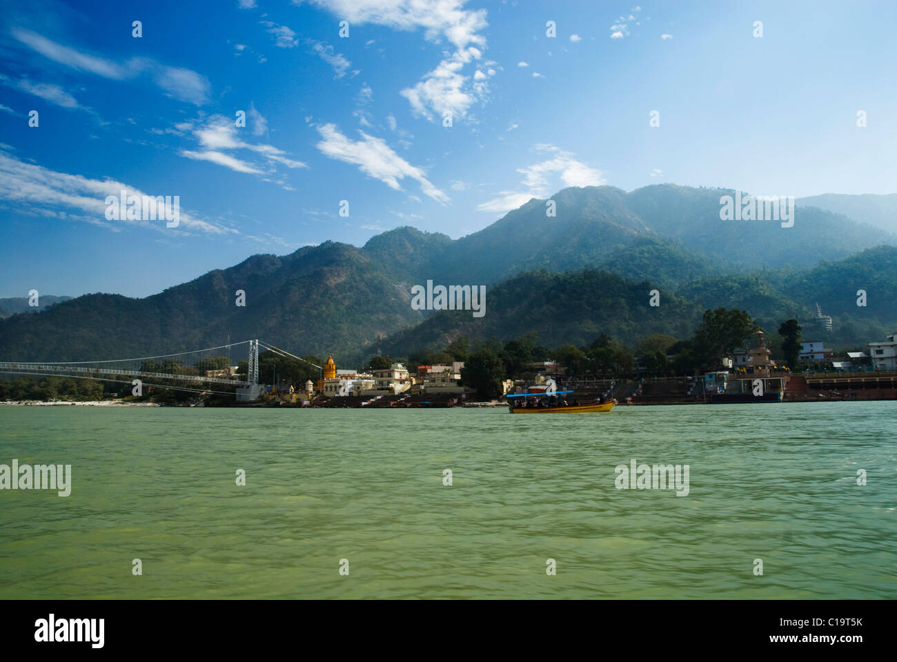 Suspension bridge across a river, Ram Jhula, Ganges River, Rishikesh ...