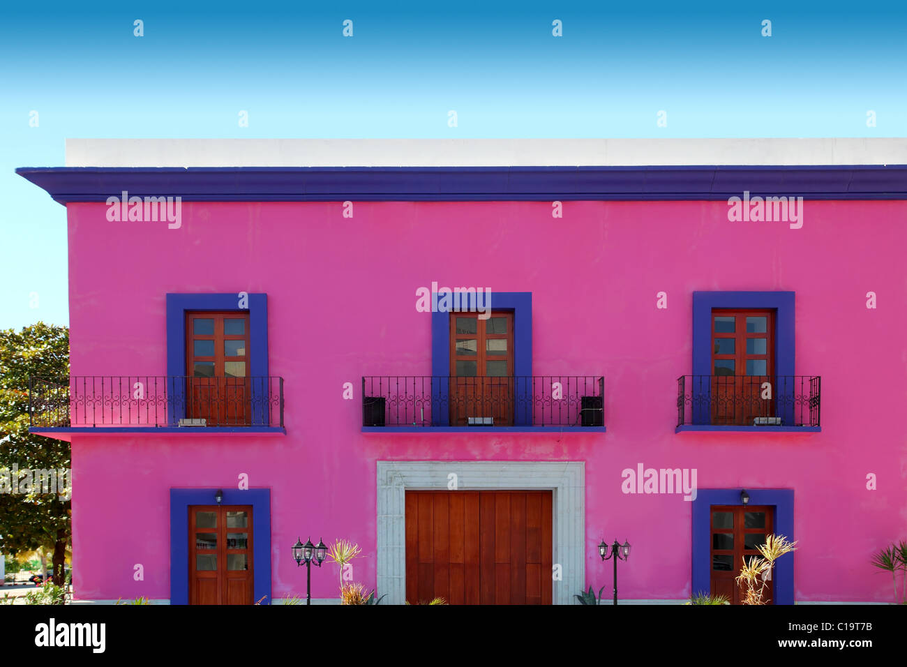 Mexican pink house facade detail wooden doors Stock Photo - Alamy