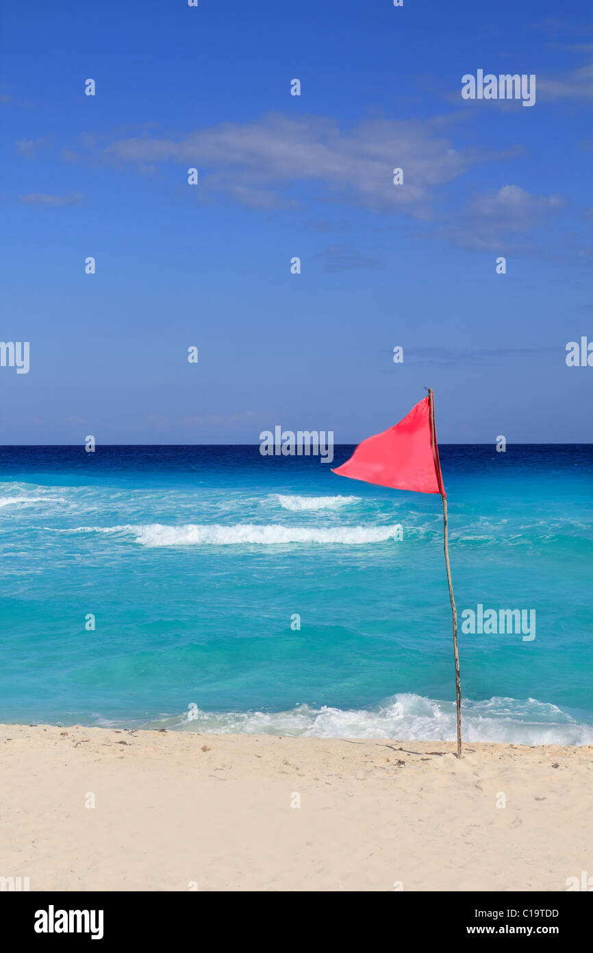 dangerous red flag in beach with rough sea signal Stock Photo - Alamy