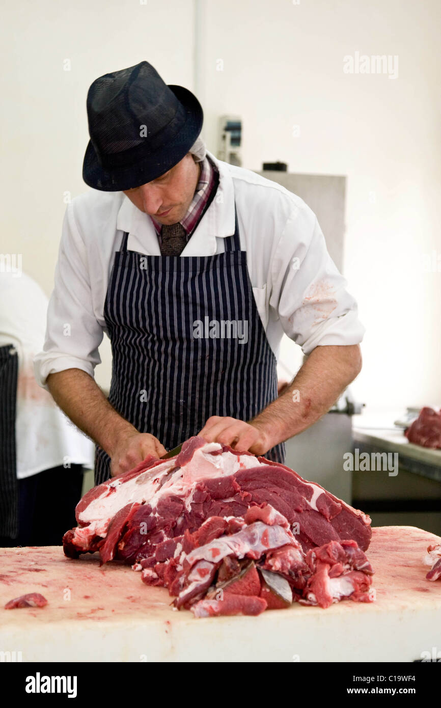 Butchers working in a cutting room Stock Photo - Alamy