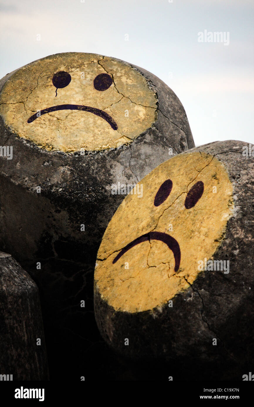 Close up detail of two painted smileys on a concrete rock Stock Photo ...