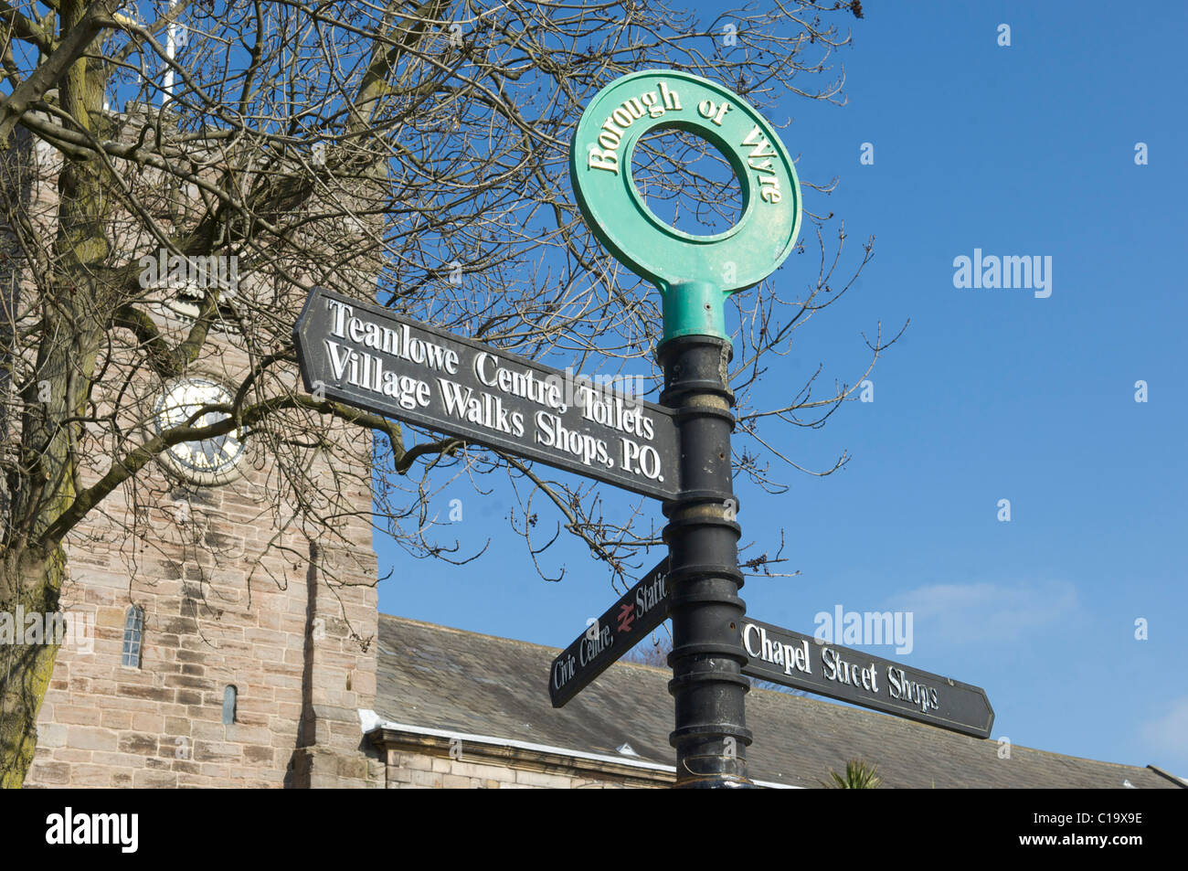 Sign pointing direction to town centre amenities Stock Photo - Alamy