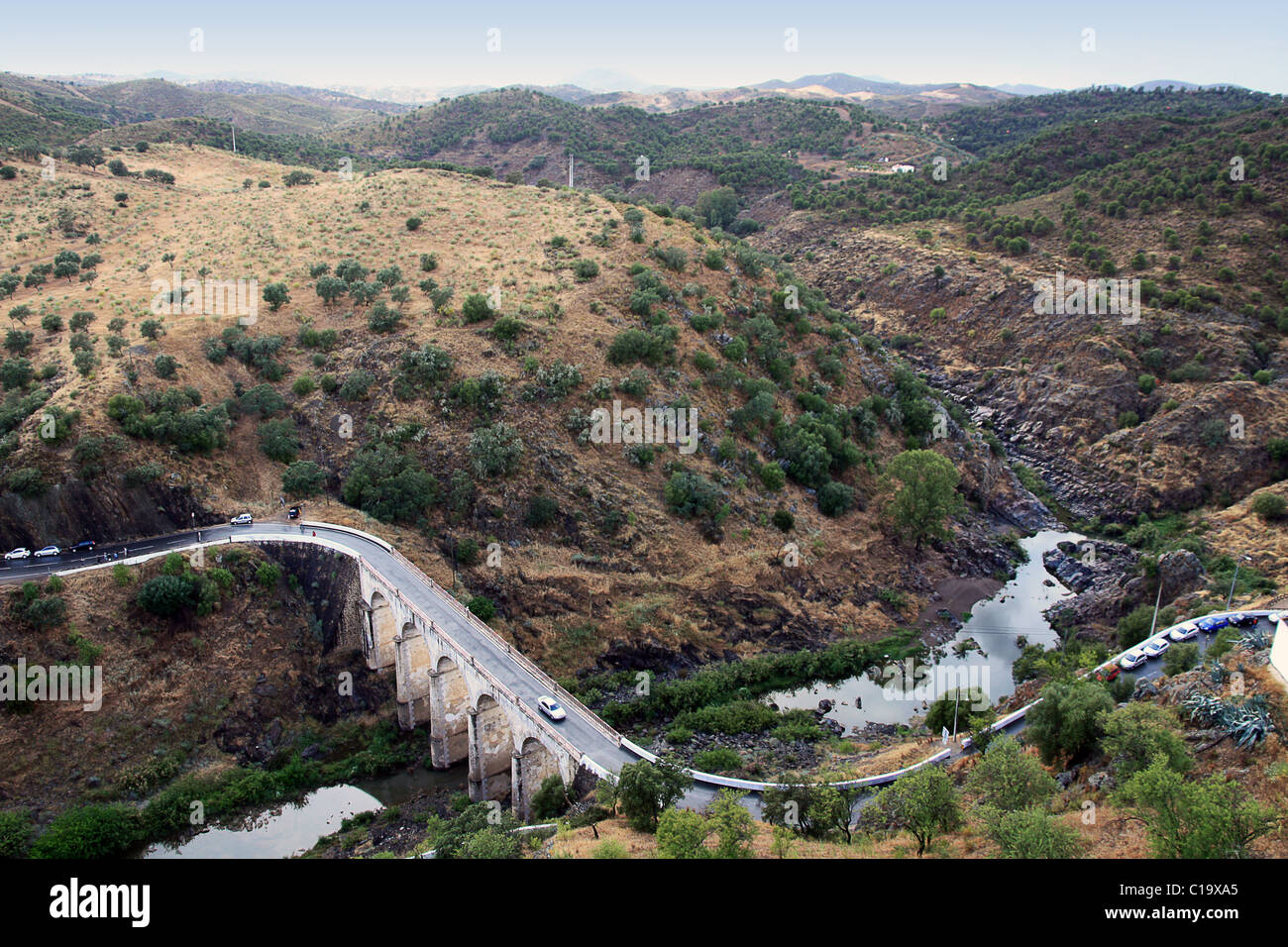 View of Mértola's bridge with mountains and a river Stock Photo - Alamy