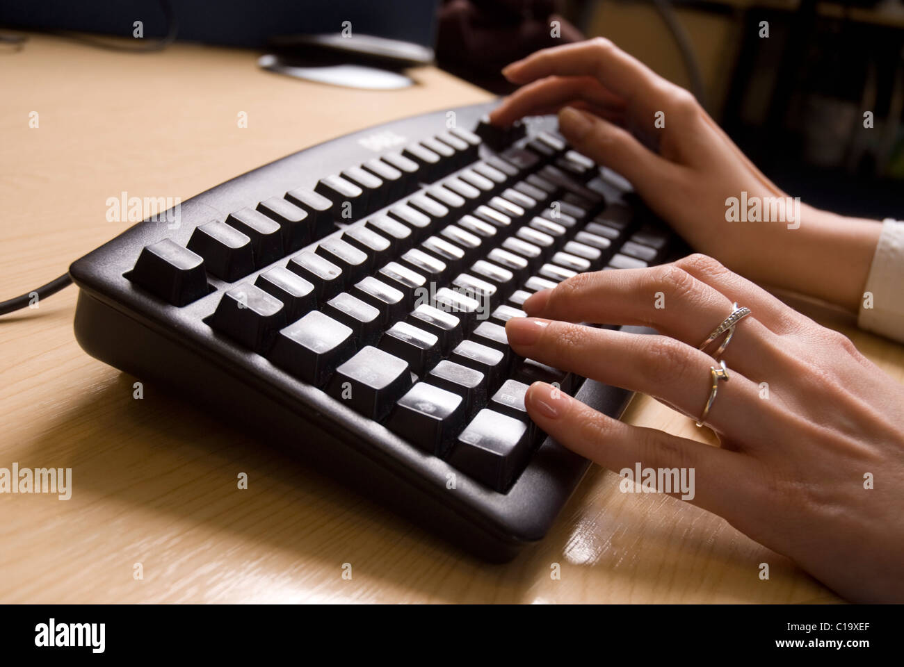 Typing on a computer keyboard Stock Photo - Alamy