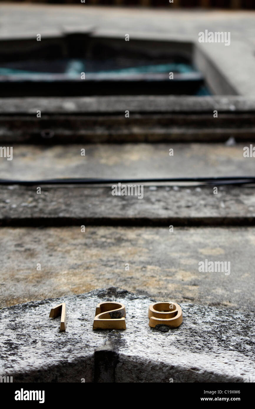 low angle perspective of the number 129 on the door of a building Stock ...