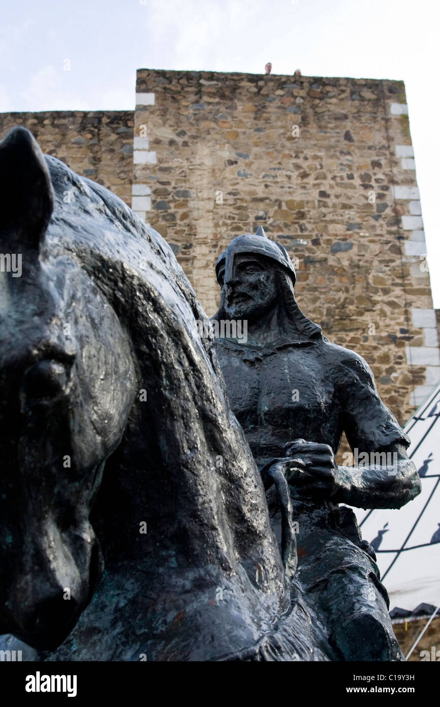 Statue of a medieval horseman warrior on top of a horse, behind a ...