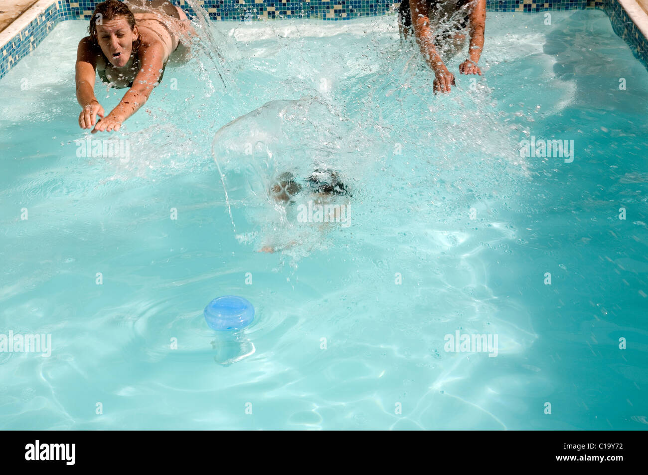 People diving into pool Stock Photo - Alamy