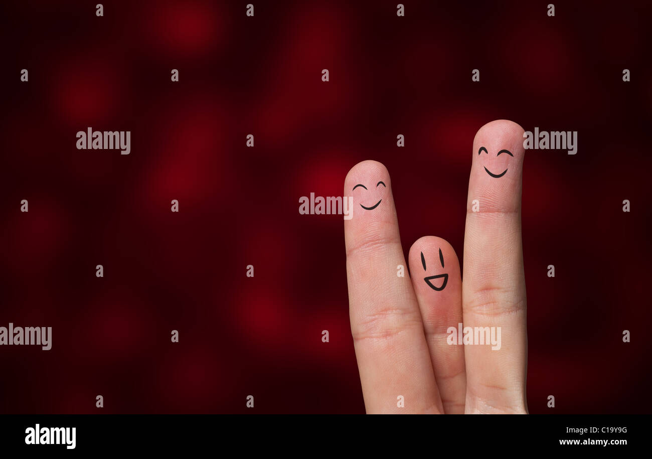 Finger hug with Abstract Lights and painted smiley Stock Photo - Alamy