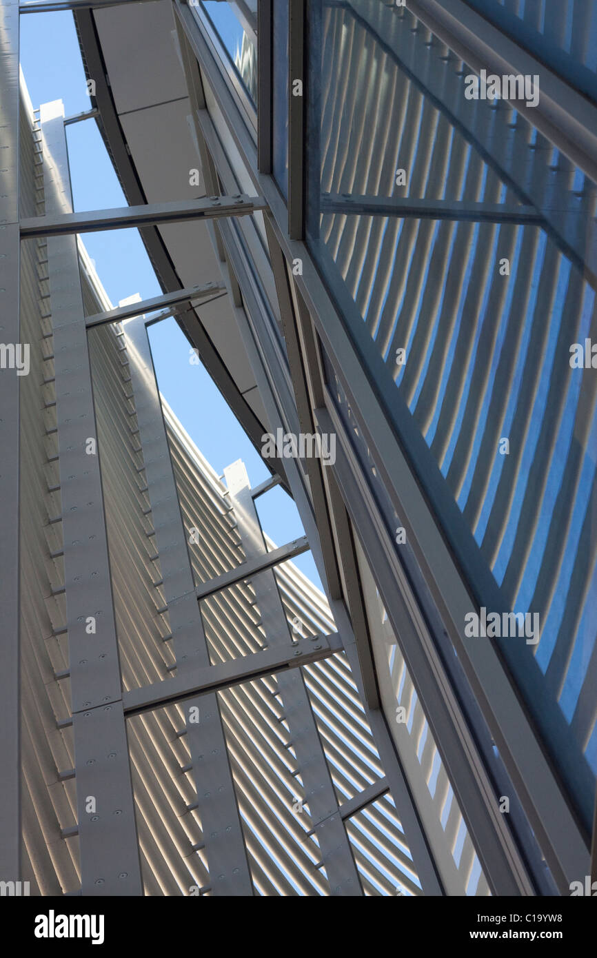 Glass and steel structure with blue sky in background Stock Photo - Alamy