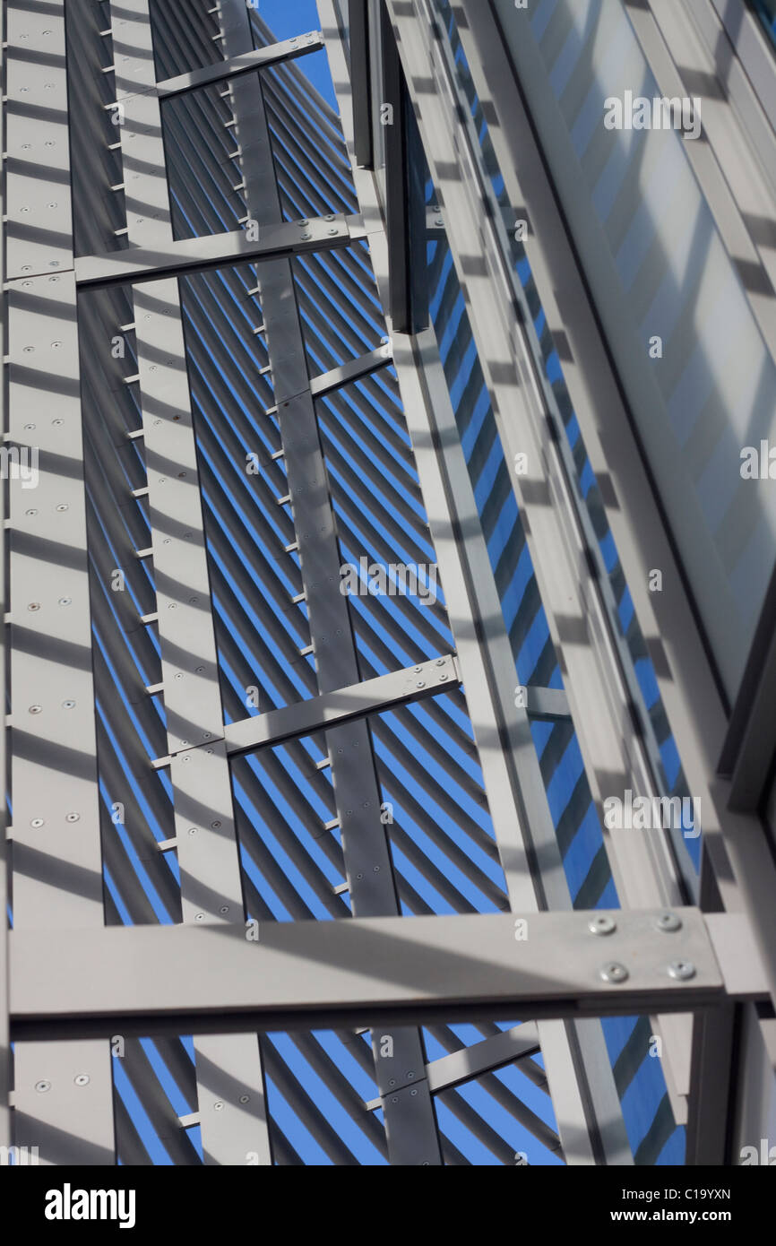 Glass and steel structure with blue sky in background Stock Photo - Alamy