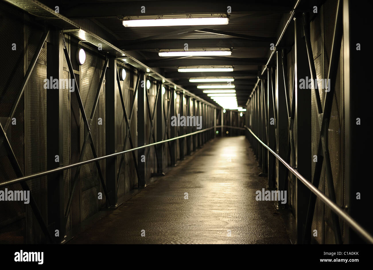 Brightly lit pedestrian walkway Stock Photo - Alamy