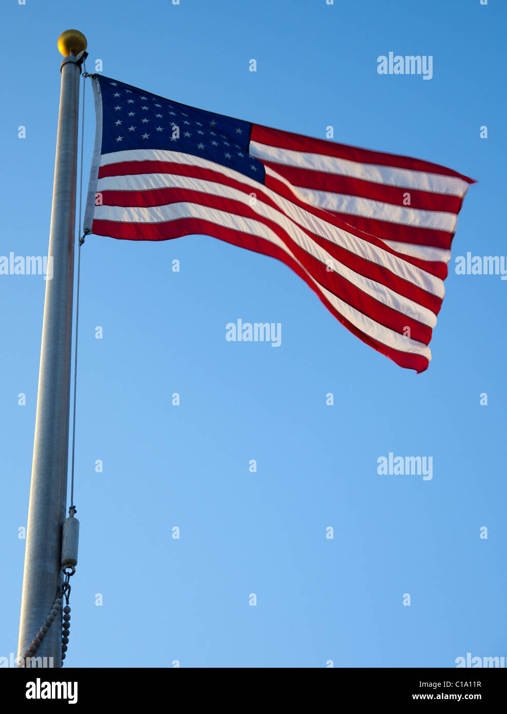 American flag waving from pole hi-res stock photography and images - Alamy