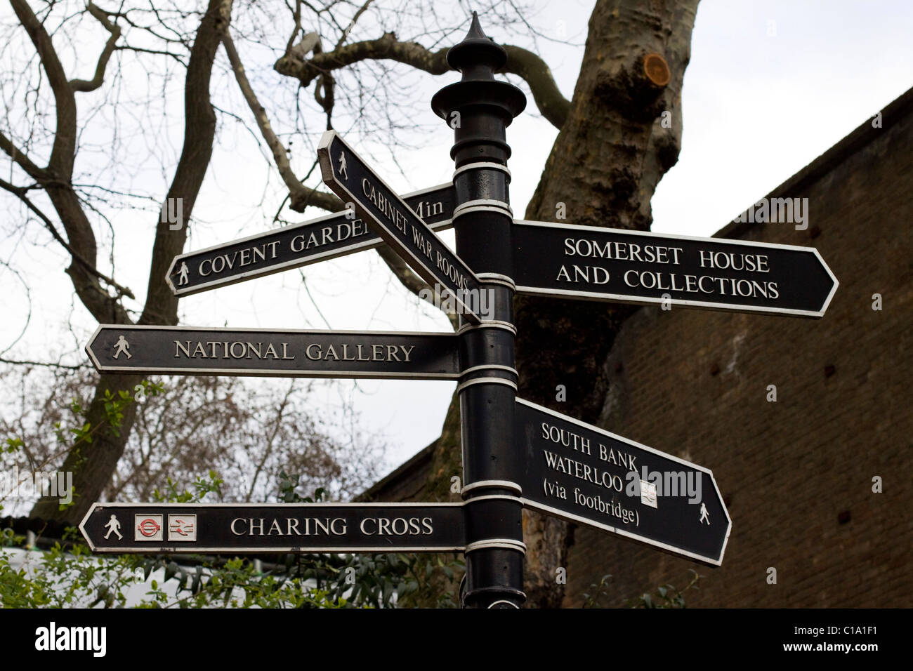 Sign post giving out information for Pedestrians in London Stock Photo ...