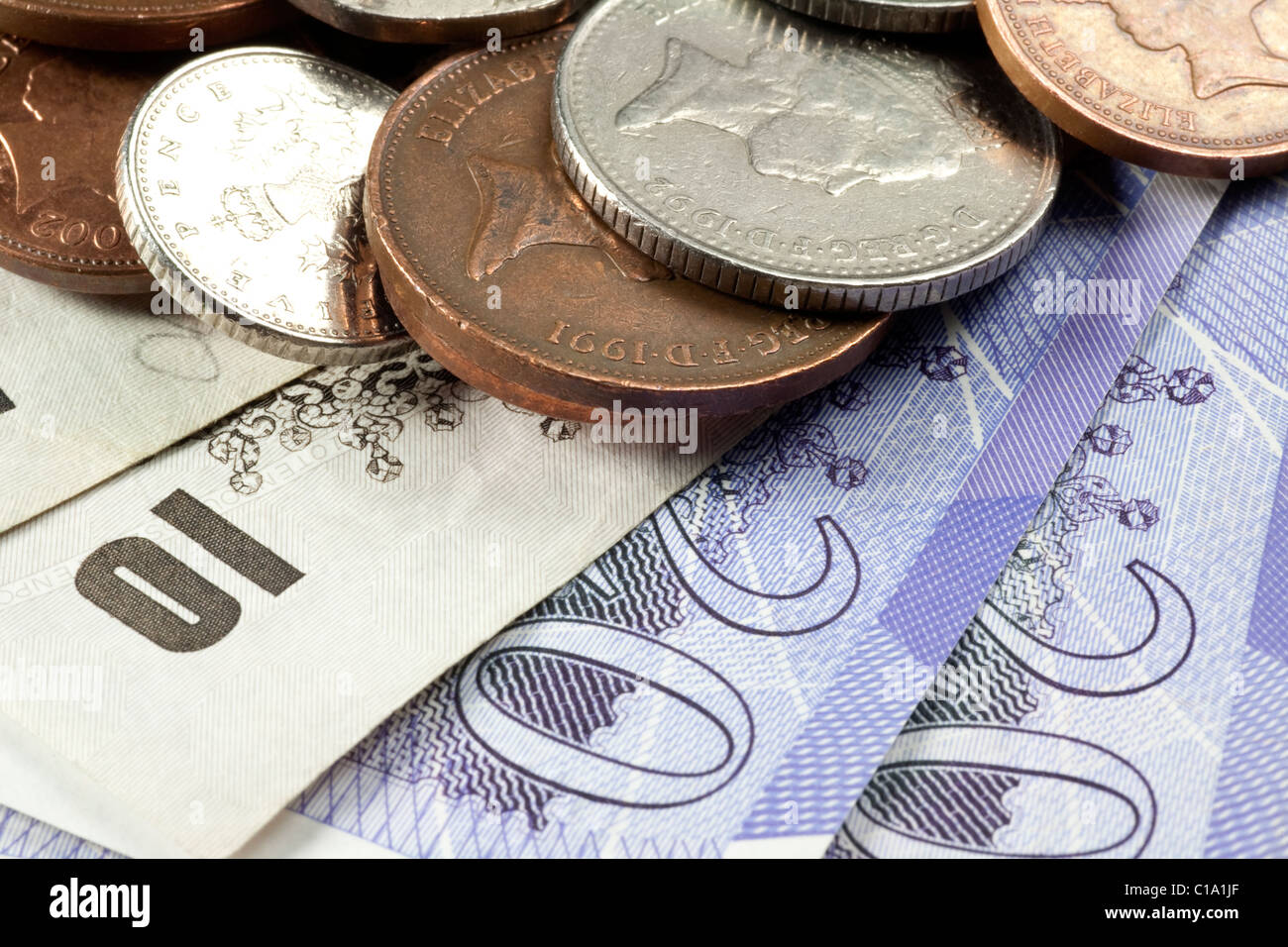 Copper, silver coins and UK bank notes Stock Photo - Alamy