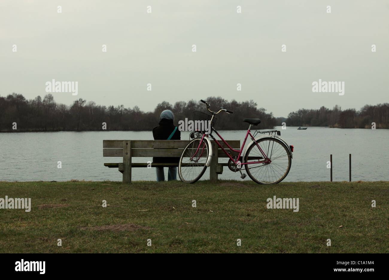 girl seating alone on the branch Stock Photo - Alamy