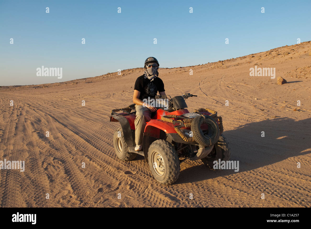 Tourist on a quad bike in the desert. Egypt Stock Photo - Alamy