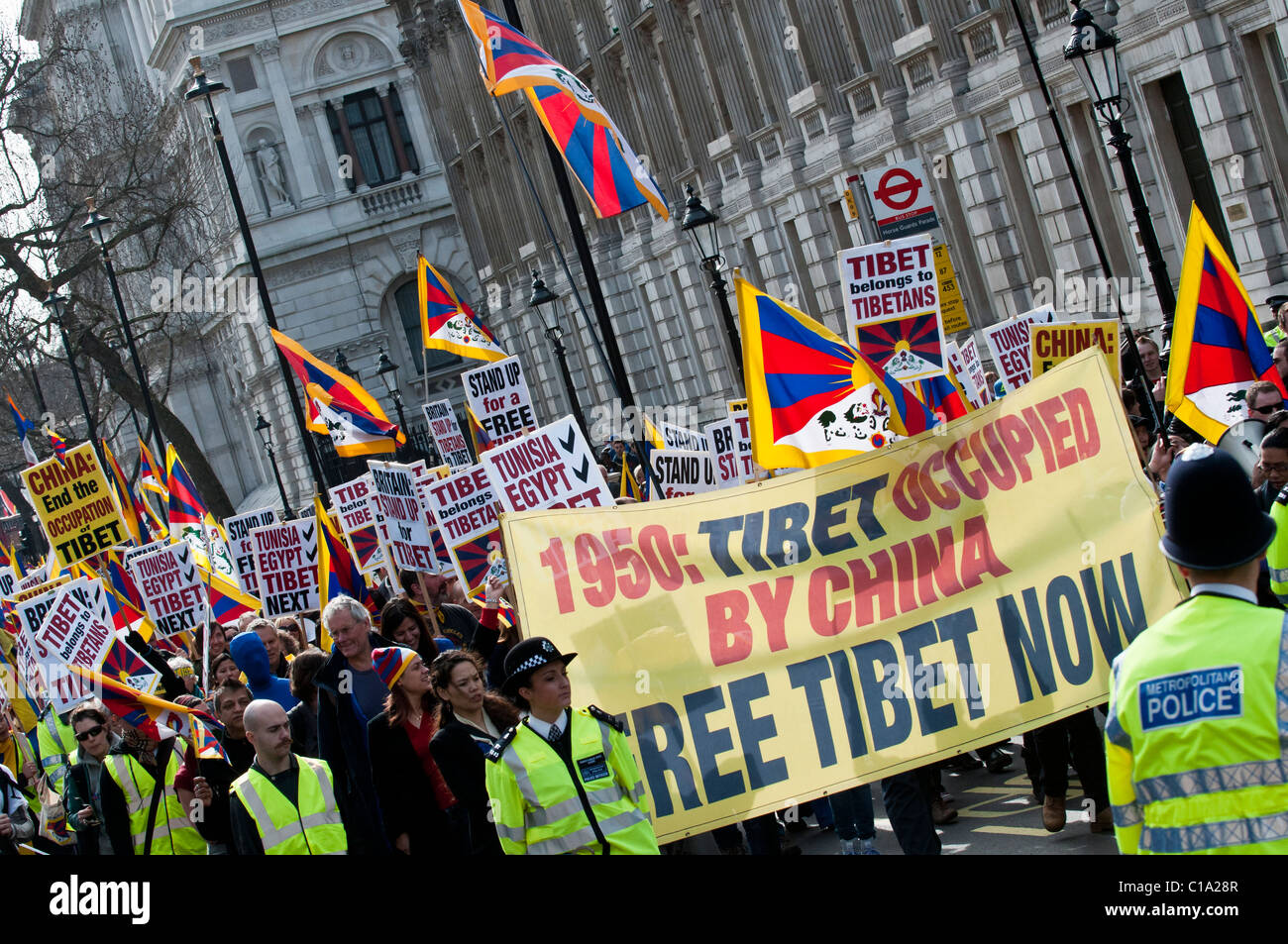Several hundred supporters of a free Tibet March from Parliament Square ...