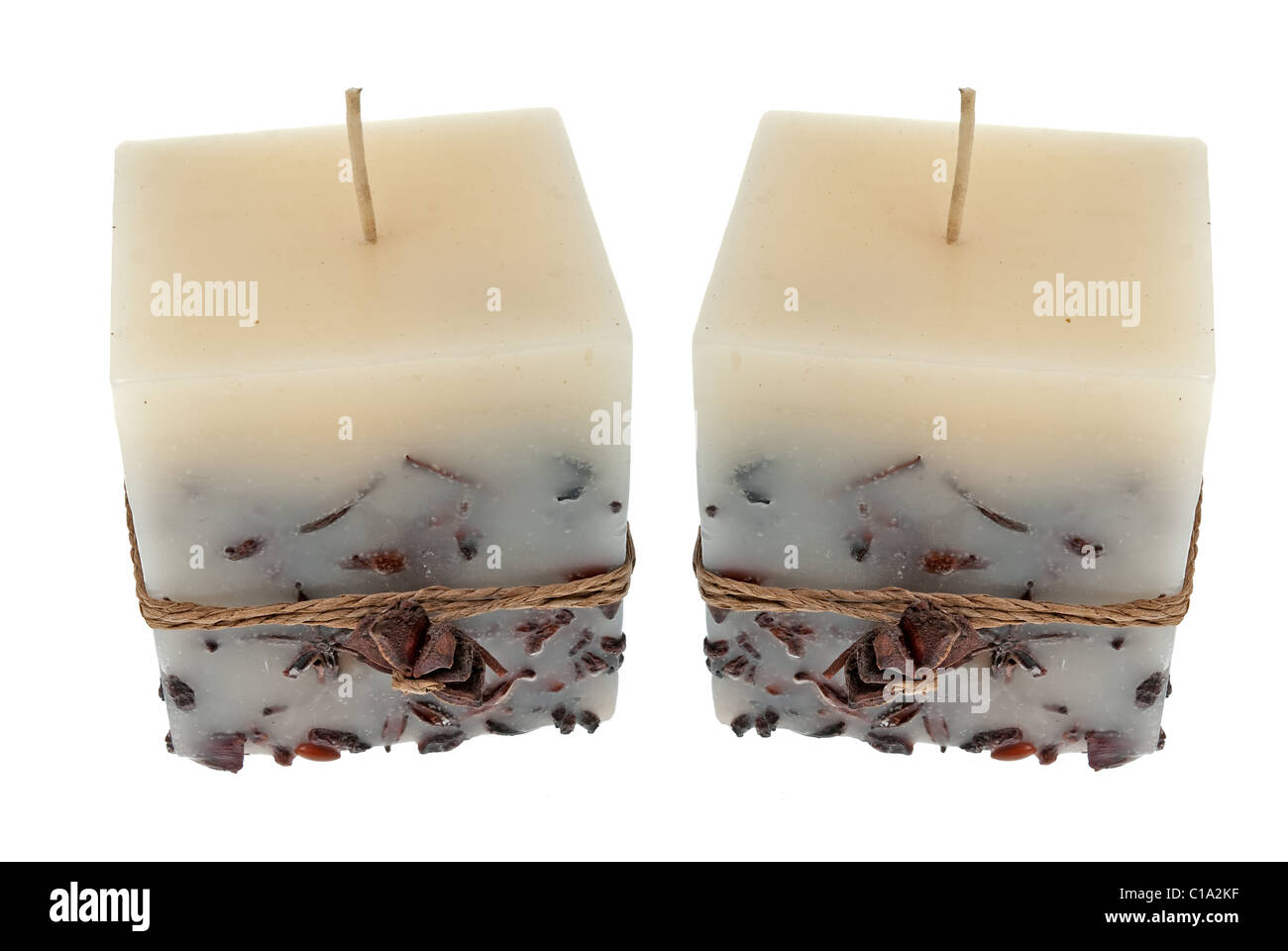 Side view of two candles isolated on white background Stock Photo - Alamy