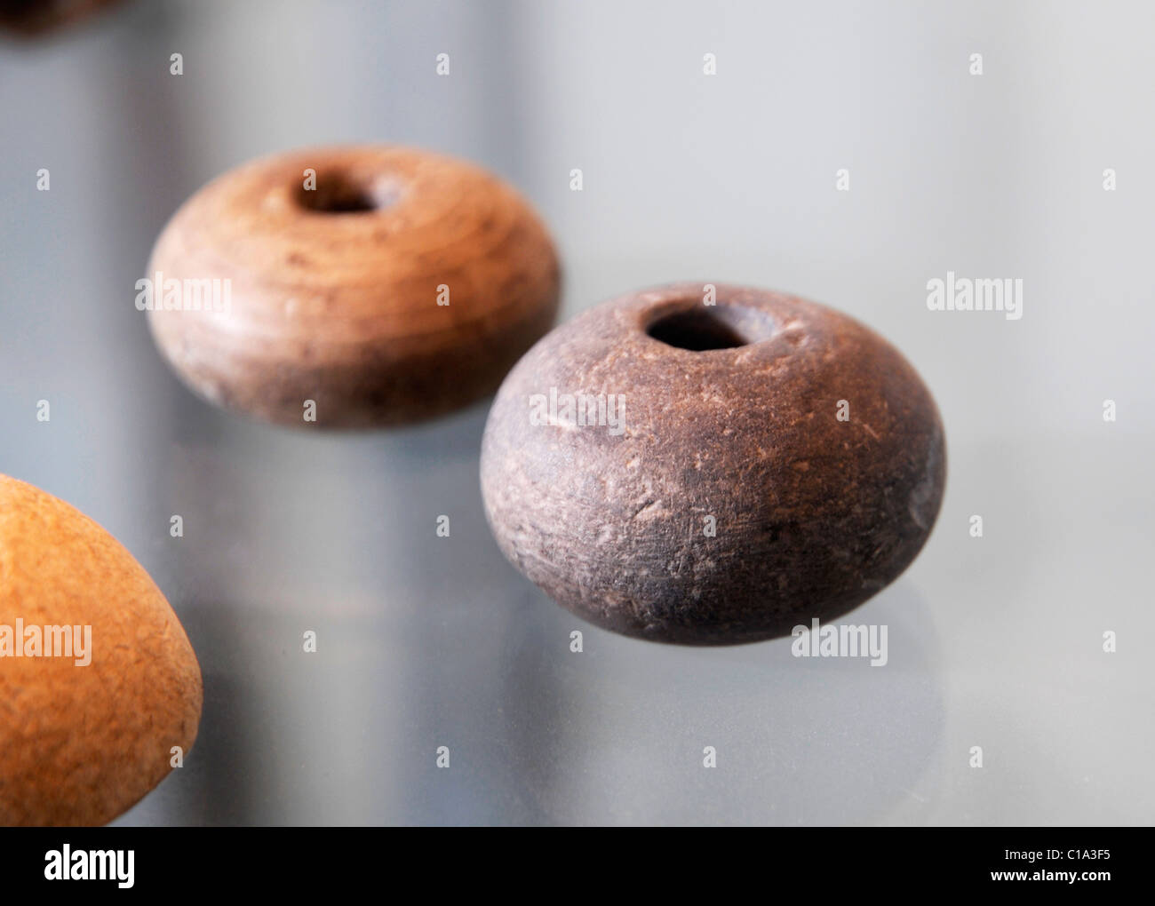 Weights used in medieval wool spinning Stock Photo - Alamy