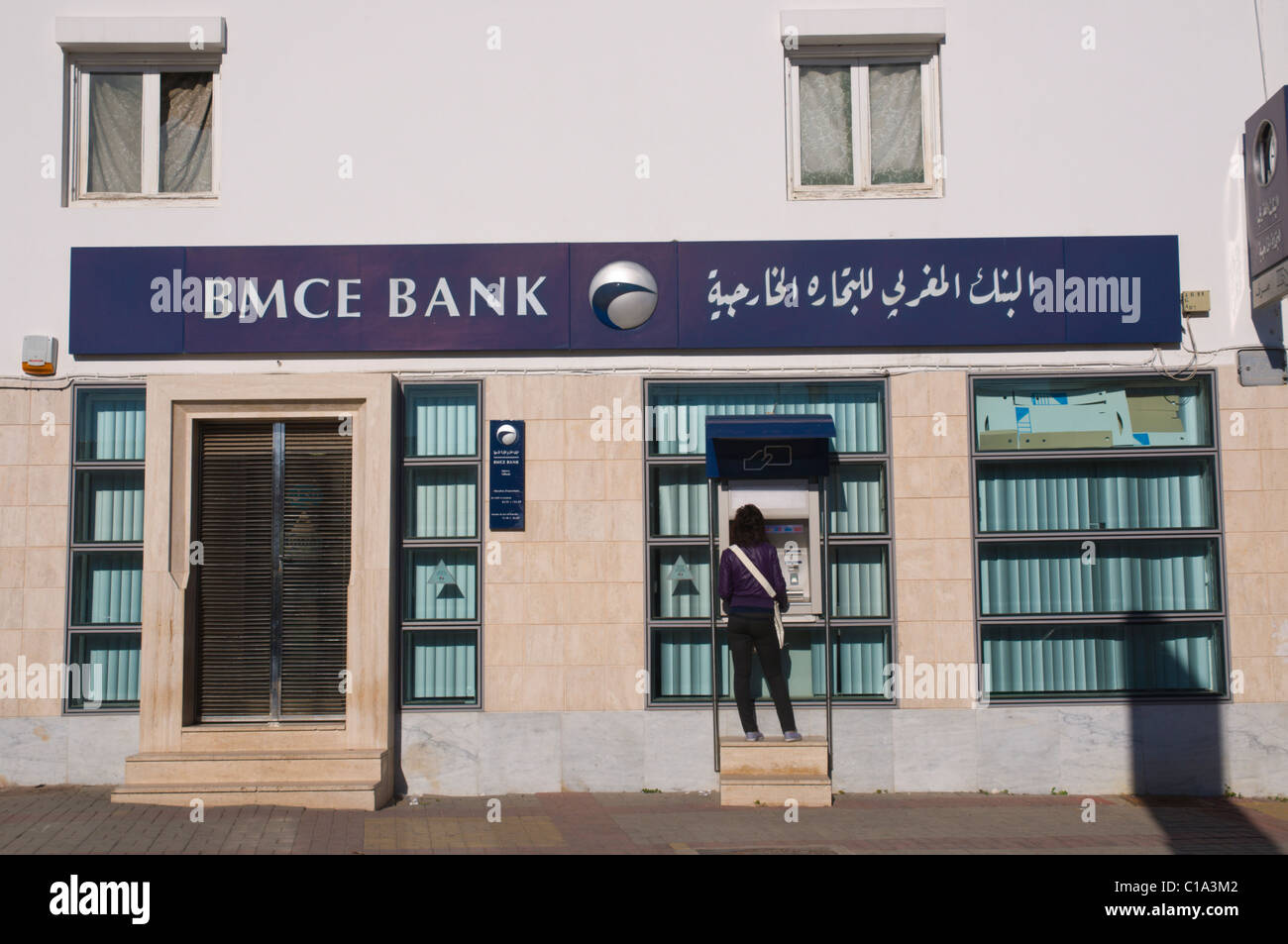Person using ATM cashpoint machine in Nouveau Talborjt district Agadir ...