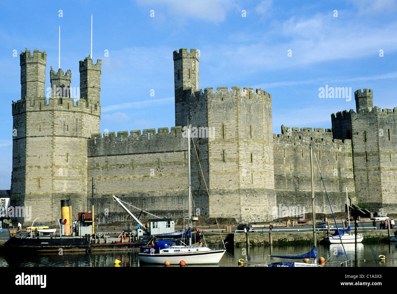 Caernarfon Castle, Wales, Welsh medieval castles UK coast coastal boats ...