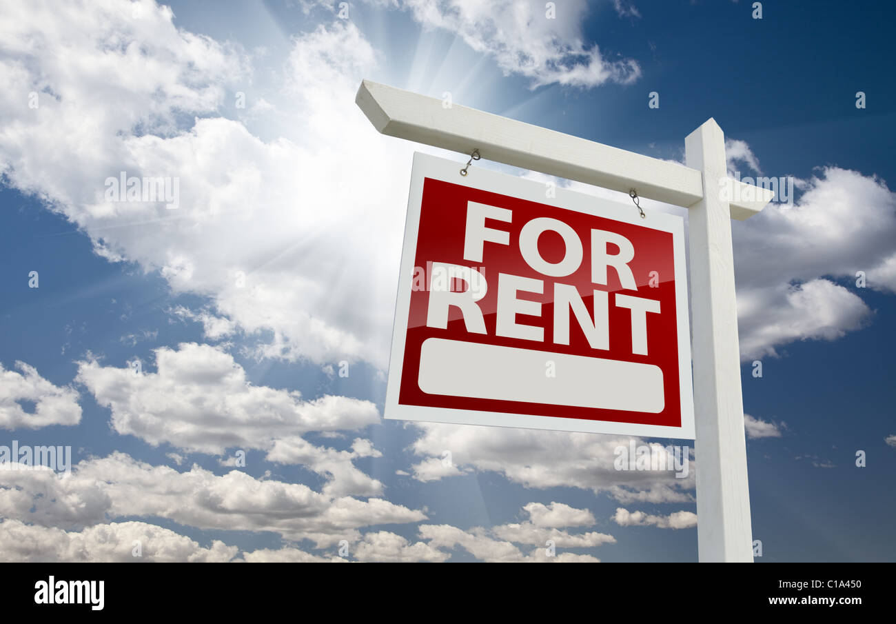Left Facing For Rent Real Estate Sign Over Clouds and Sunny Sky with ...