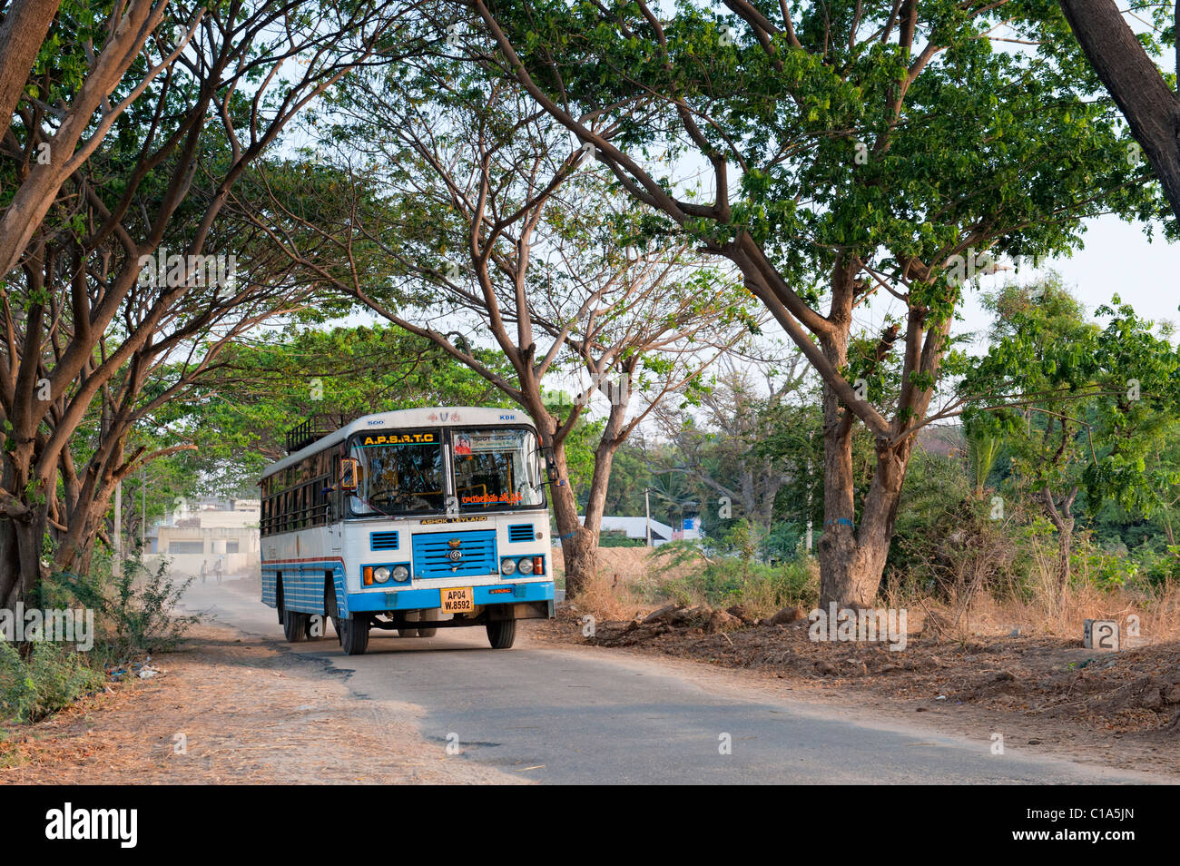 Indian bus / coach traveling early morning in the countryside. Andhra ...