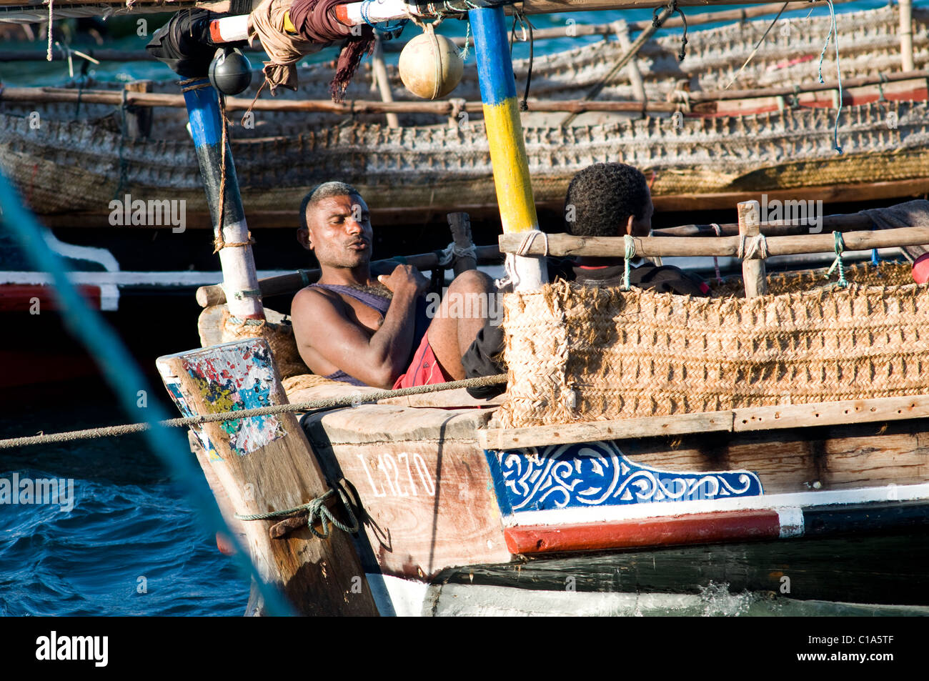 Fisherman on dhow, Old Stone Town, Lamu, Kenya Stock Photo - Alamy