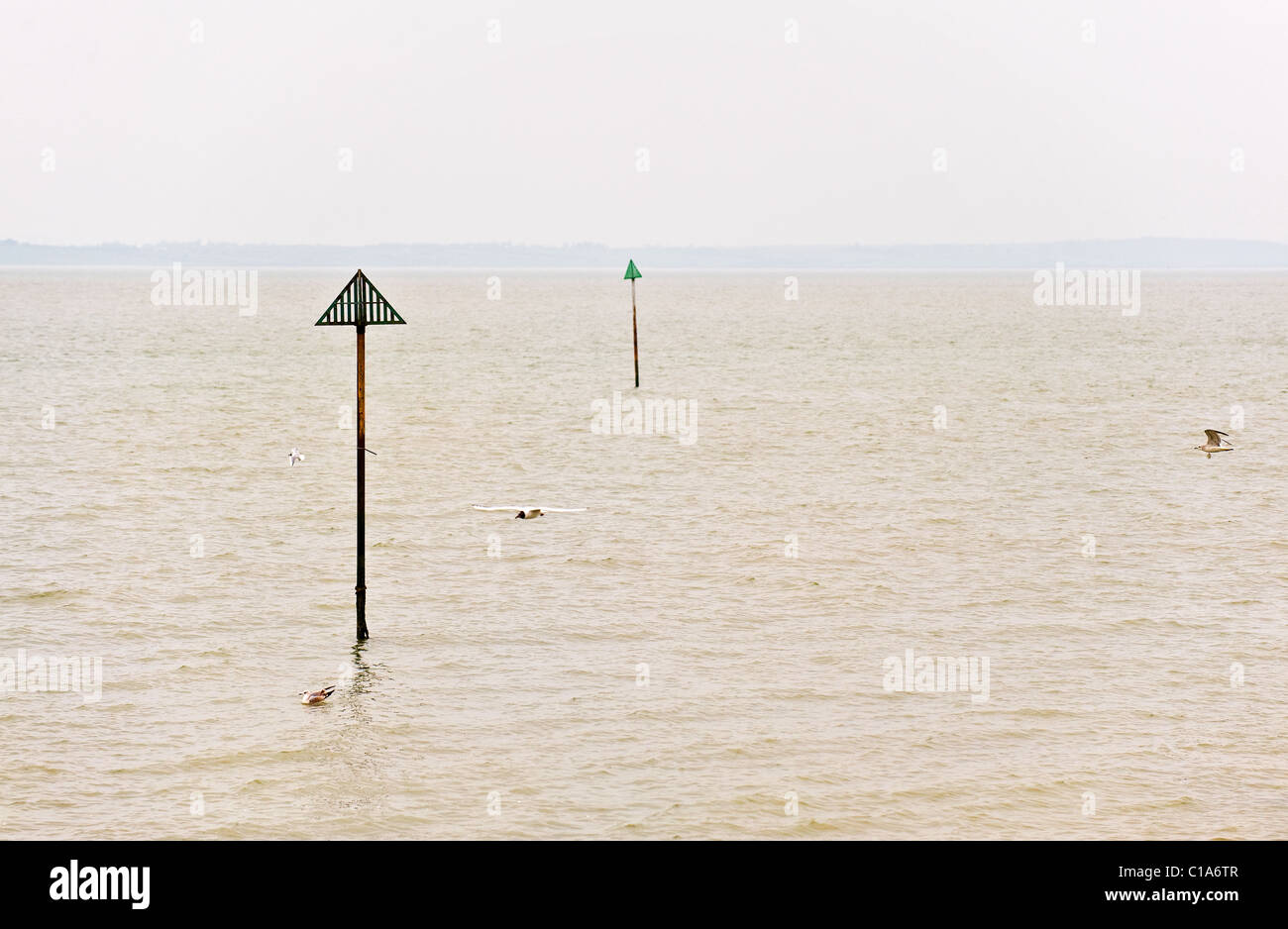 Hazard warning poles in the Thames Estuary. Photograph by Gordon ...