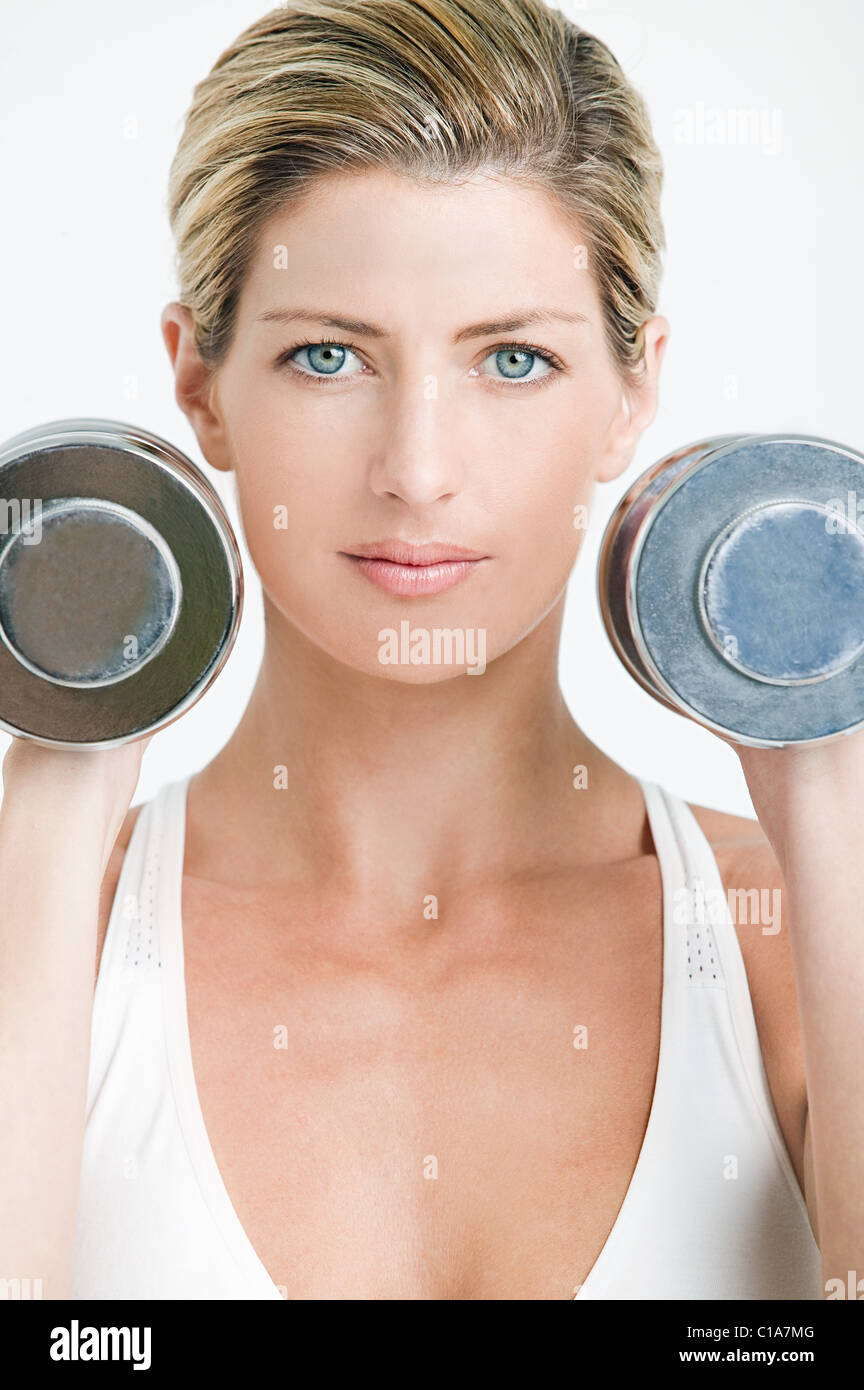 Young woman with hand weights Stock Photo - Alamy